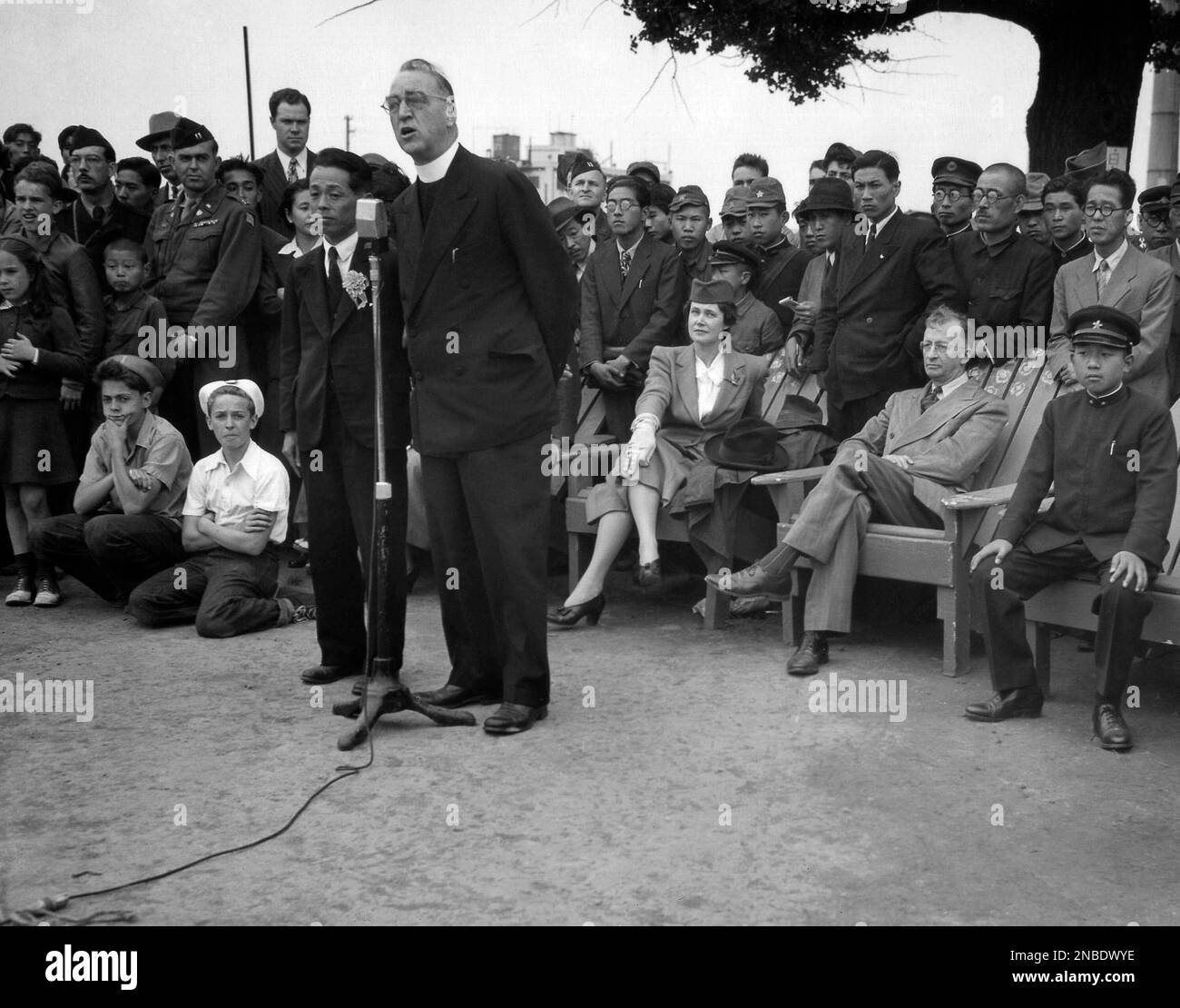 Father Edward J. Flanagan, founder of Boy’s Town, Nebraska, speaks into ...
