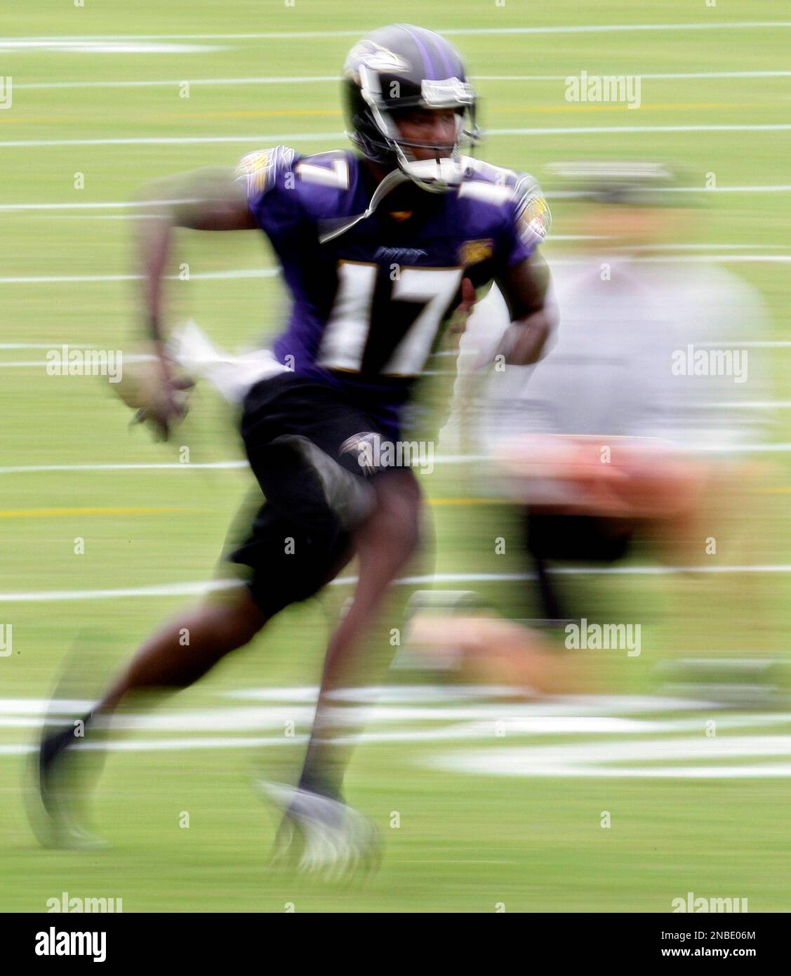 In this image made with a slow shutter, Baltimore Ravens wide receiver ...