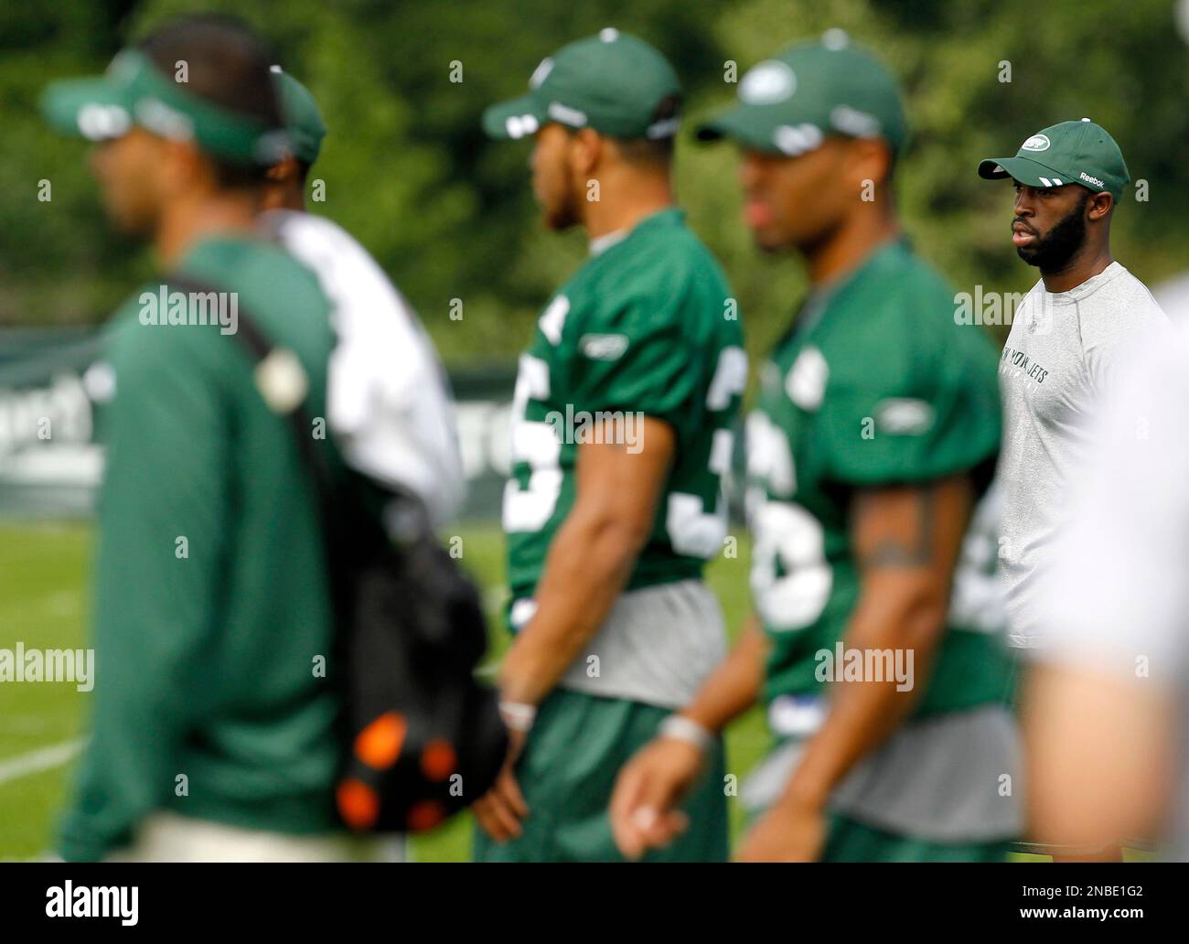 New York Jets DaJuan Morgan, right, looks on while the defense runs ...
