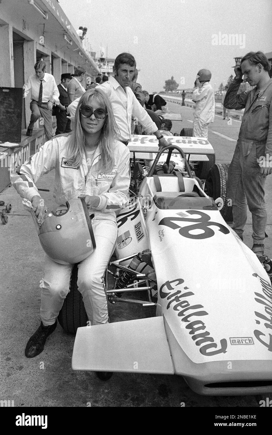 German woman racing driver Hannelore Werner holds her helmet while ...