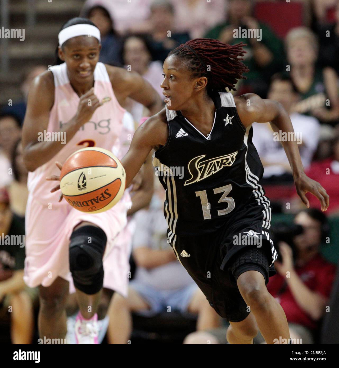 Seattle Storm's Swin Cash, left, trails San Antonio Silver Stars ...