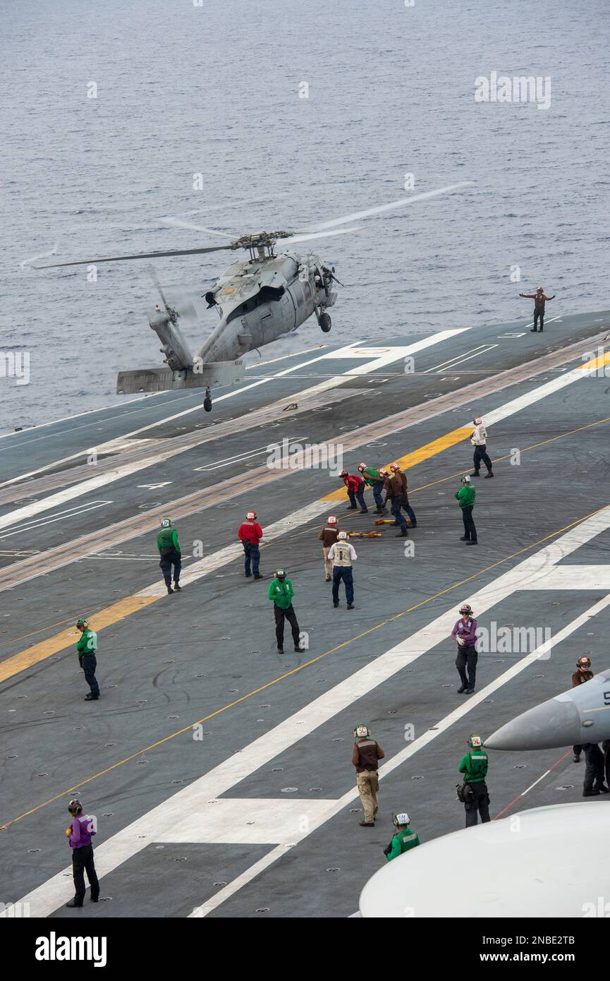 230212-N-NX635-1370 SOUTH CHINA SEA (Feb. 12, 2023) An MH-60S Sea Hawk ...