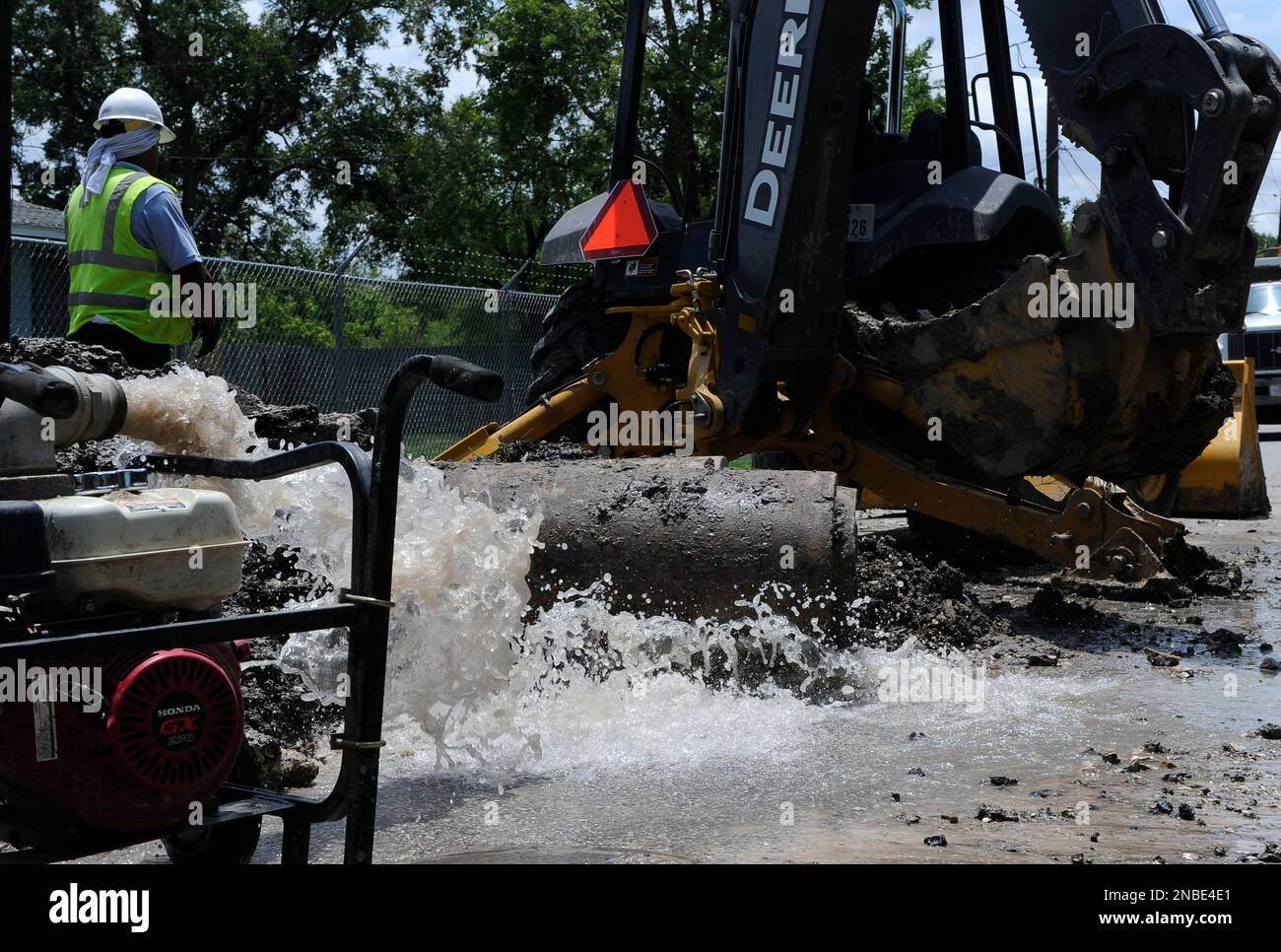 In this photo taken July 27, 2011, water is pumped out of the ground as ...