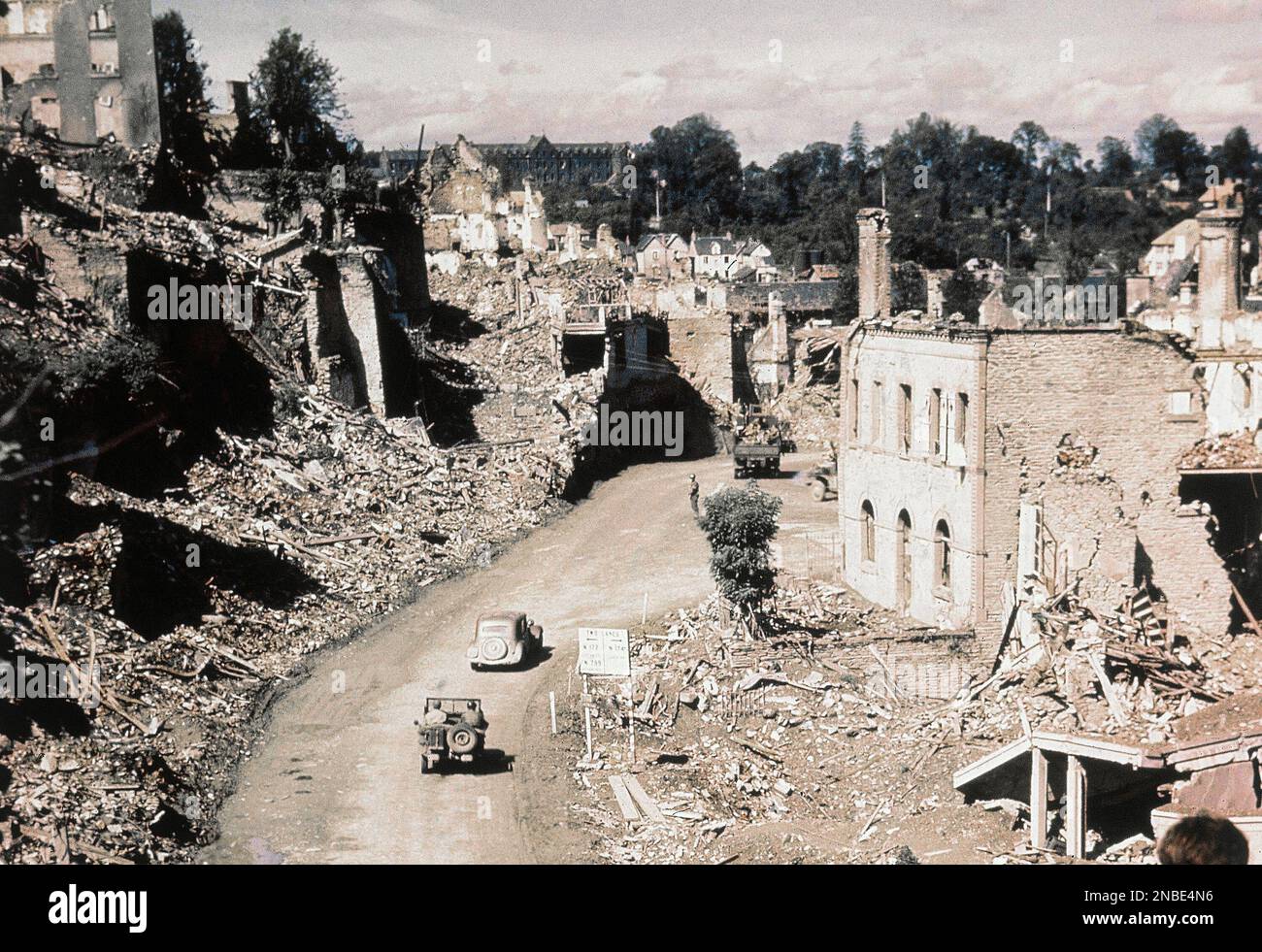 The road leading into St. Lo, France, shown July 1944. Convoys of ...