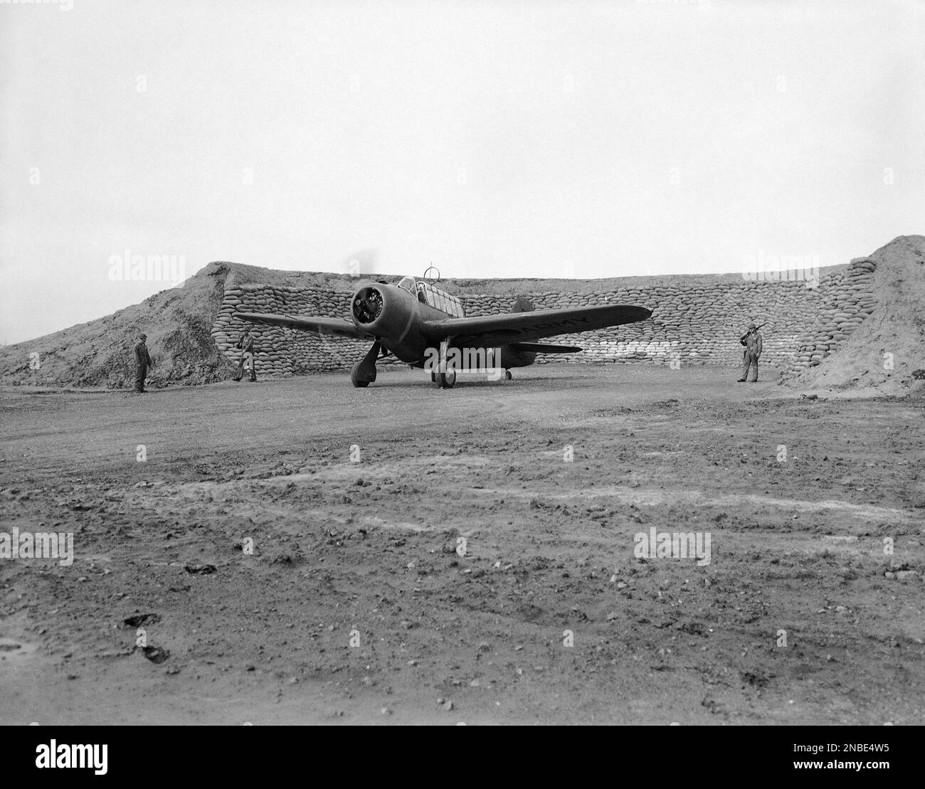 A U.S. Army observation plane pulls out of a revetment somewhere along ...
