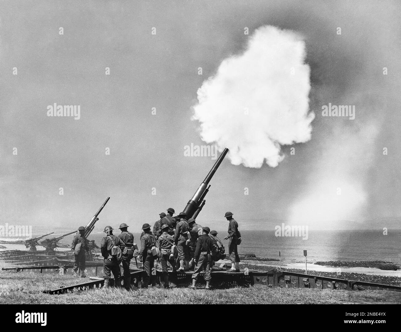 With a mighty roar, anti-aircraft gun lets go at a target towed by ...