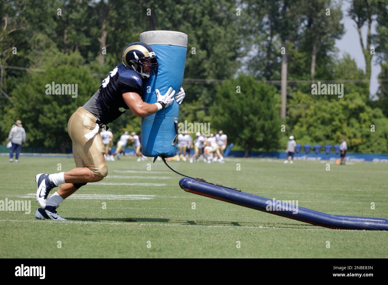 St. Louis Rams linebacker Josh Hull works with a blocking dummy during ...