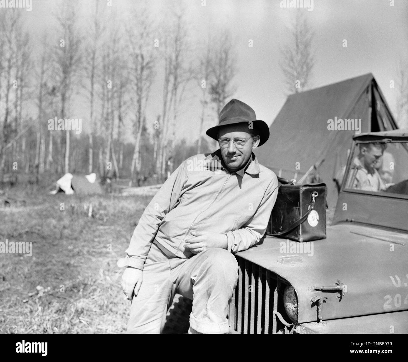 Grant MacDonald, Wide World photographer, unshaven, very dirty, and ...