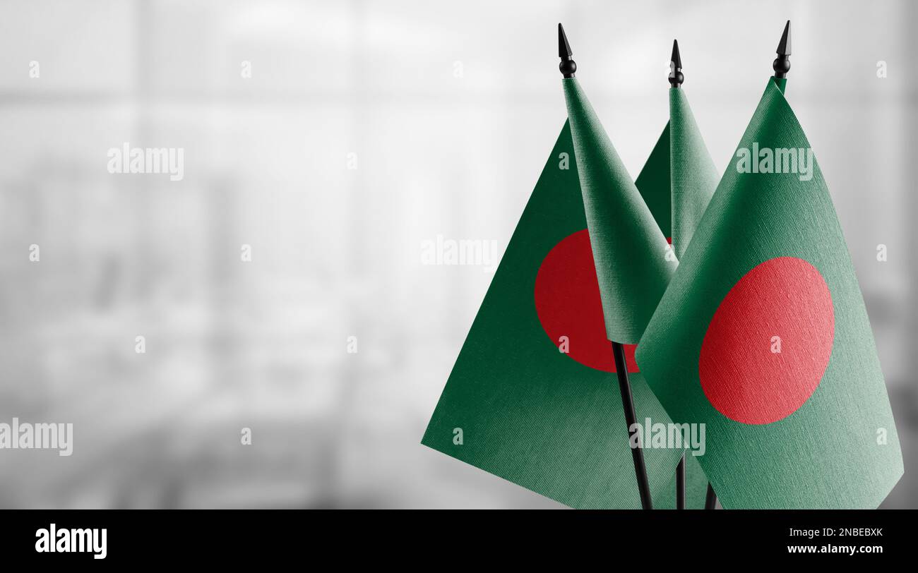 Small flags of the Bangladesh on an abstract blurry background Stock ...