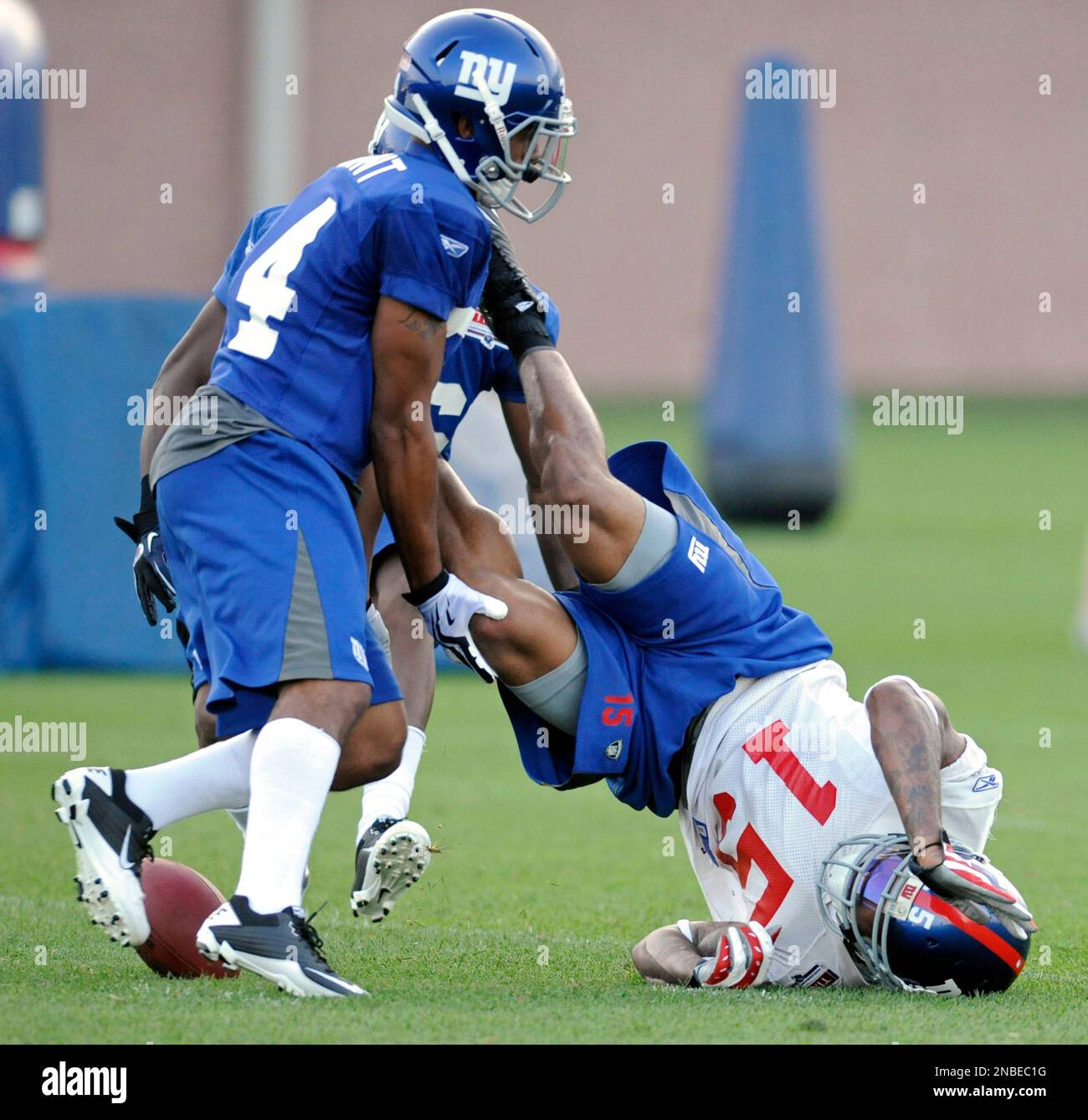 New York Giants safety Jarrard Tarrant, left, breaks up a pass intended ...