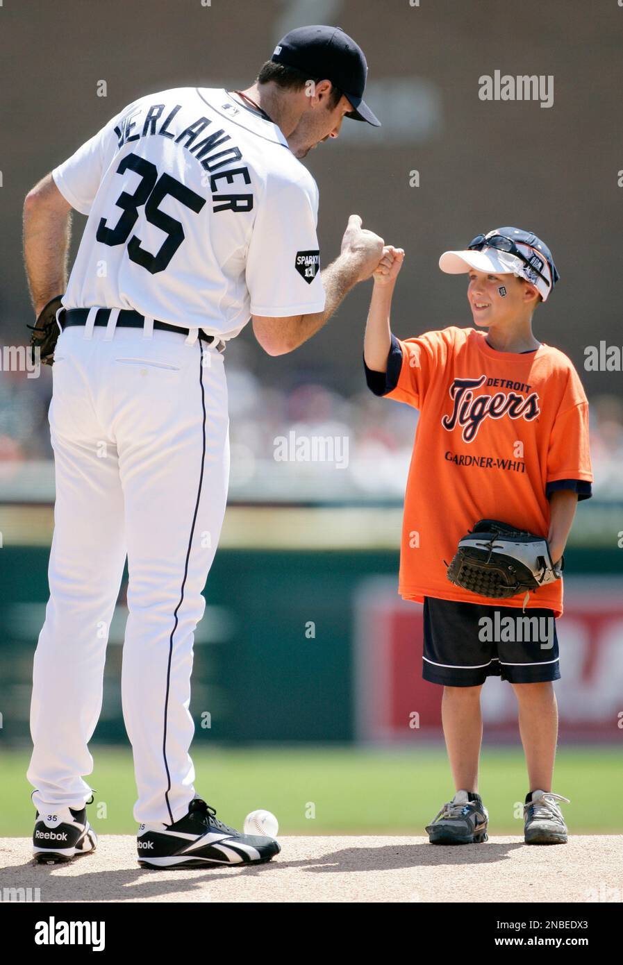 Dallas Bolster, right, of Dundee, Mich., gets a fist-bump from Detroit ...