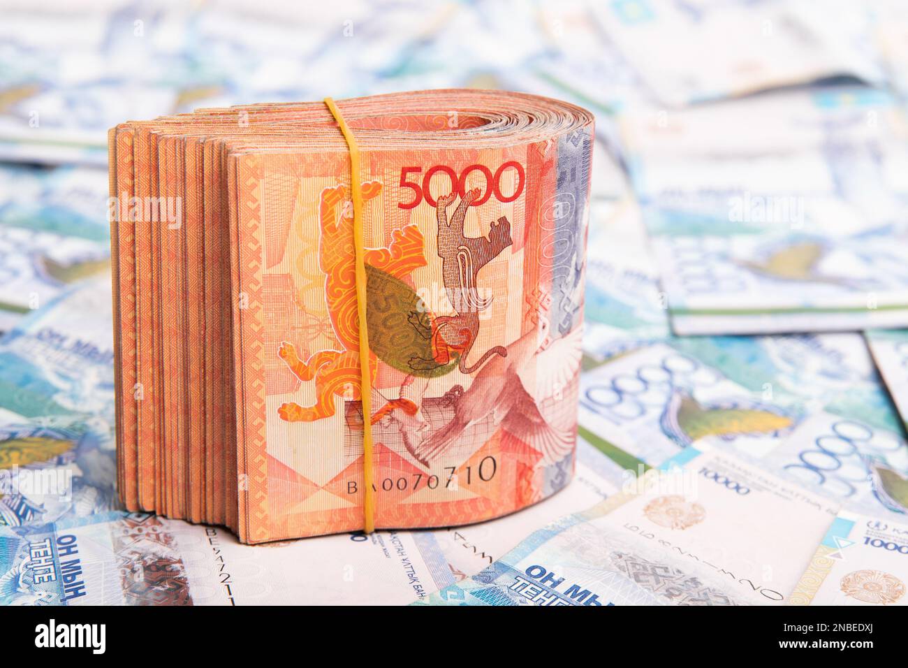 Pack of 5000 banknotes of Kazakhstan tenge, against the background of ...