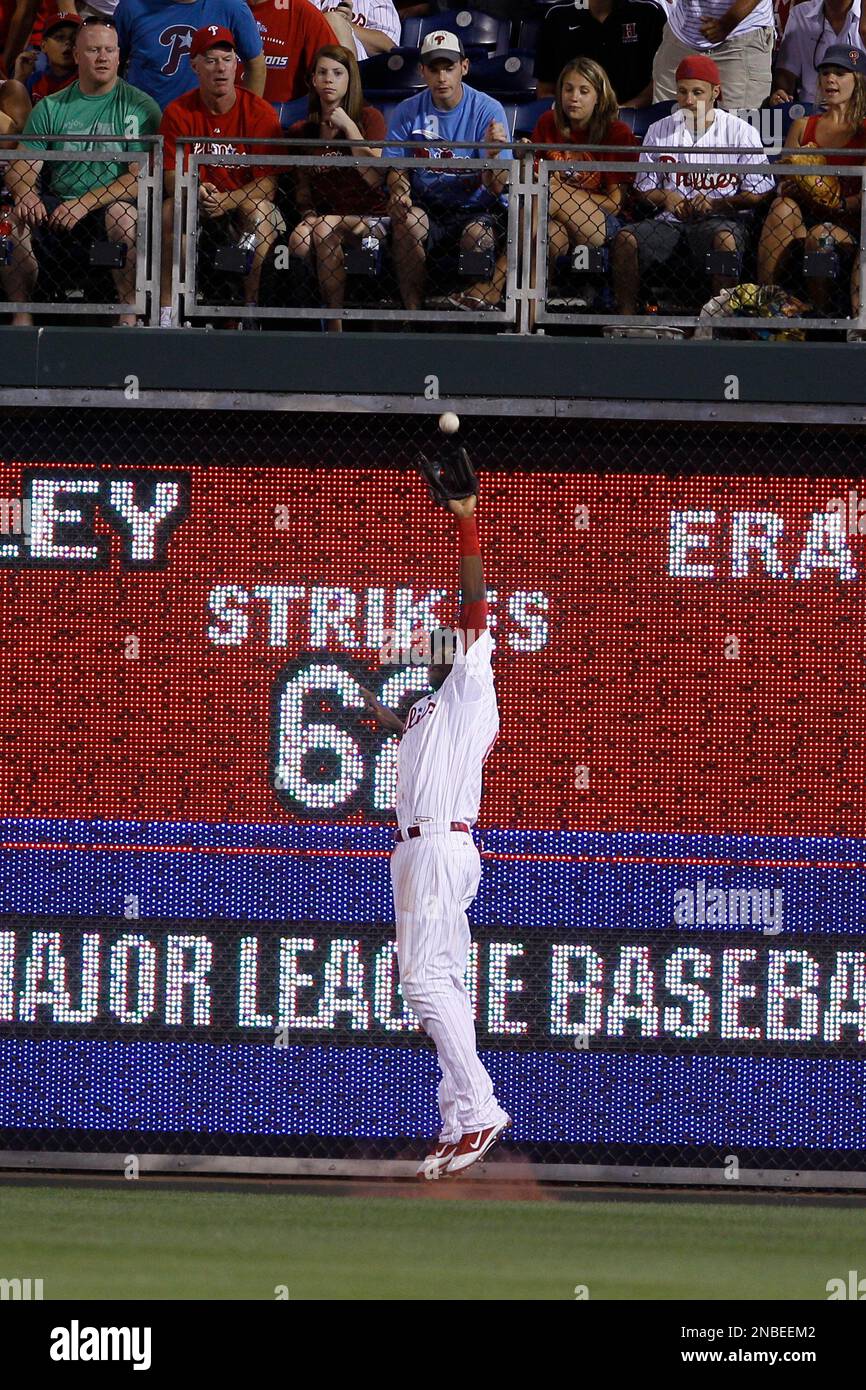 Philadelphia Phillies' John Mayberry Jr. fields a fly ball during a ...