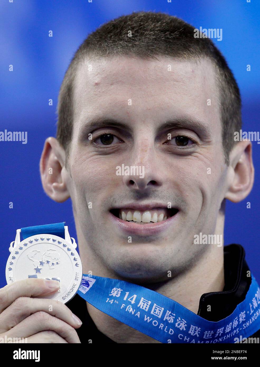 Canada's Ryan Cochrane shows the silver medal he won in the men's 1 ...