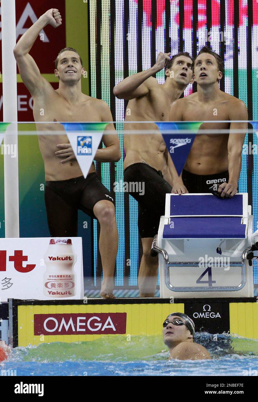U.S. team members, from left, Nicholas Thoman, Michael Phelps, Mark ...