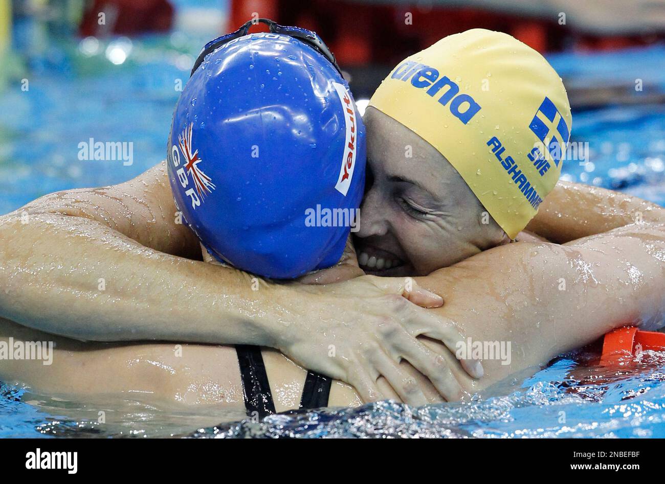 Sweden's Therese Alshammar, right, embraces Britain's Francesca Halsall ...