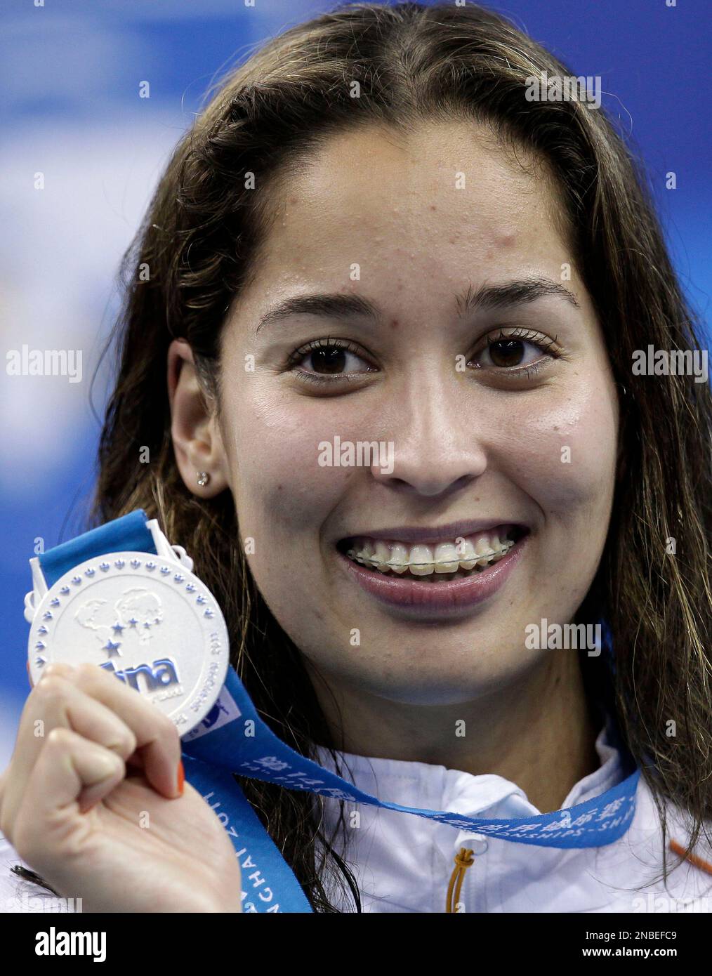 Ranomi Kromowidjojo of the Netherlands shows the silver medal she won ...