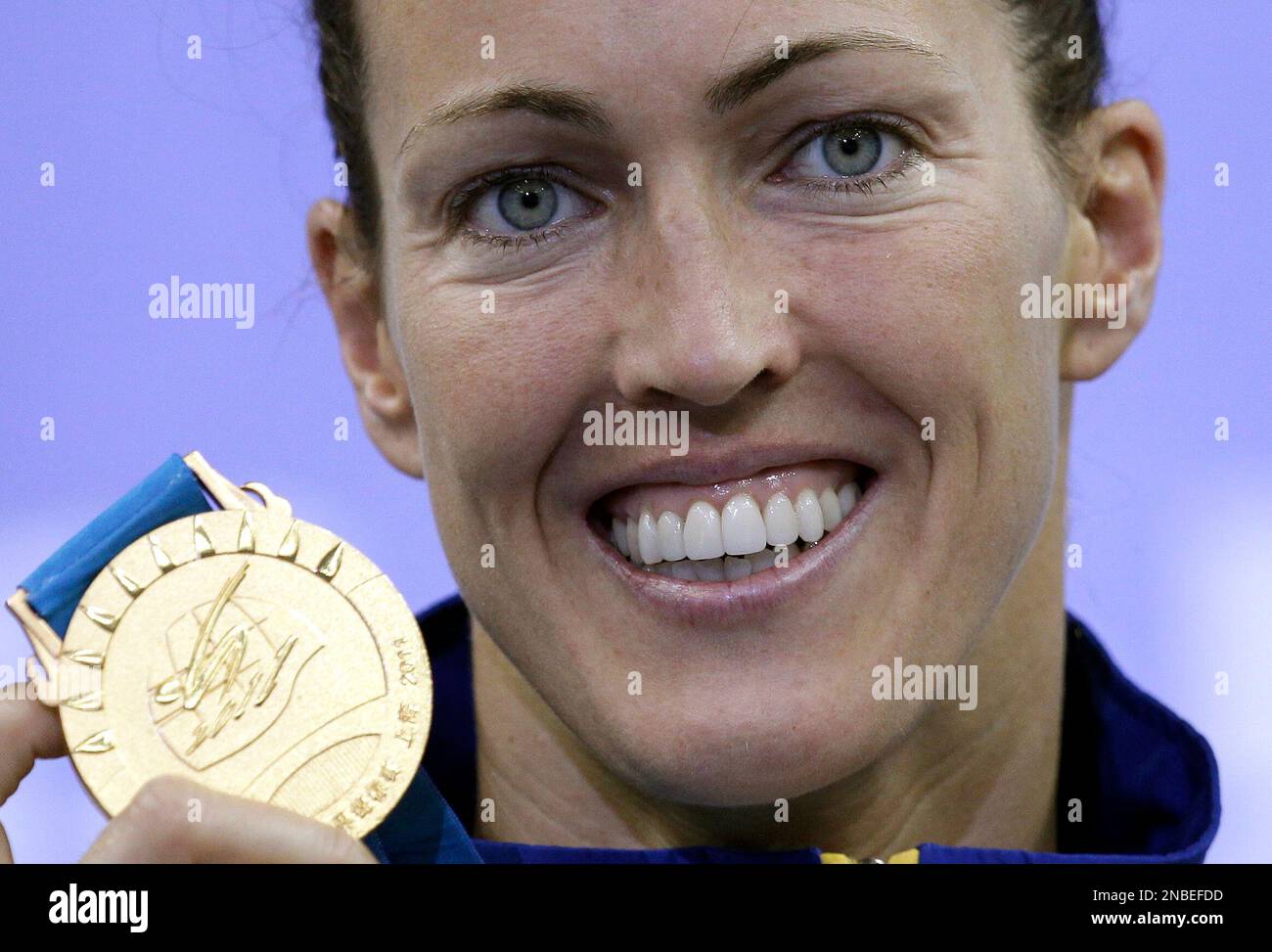 Sweden's Therese Alshammar shows the gold medal she won in the women's ...