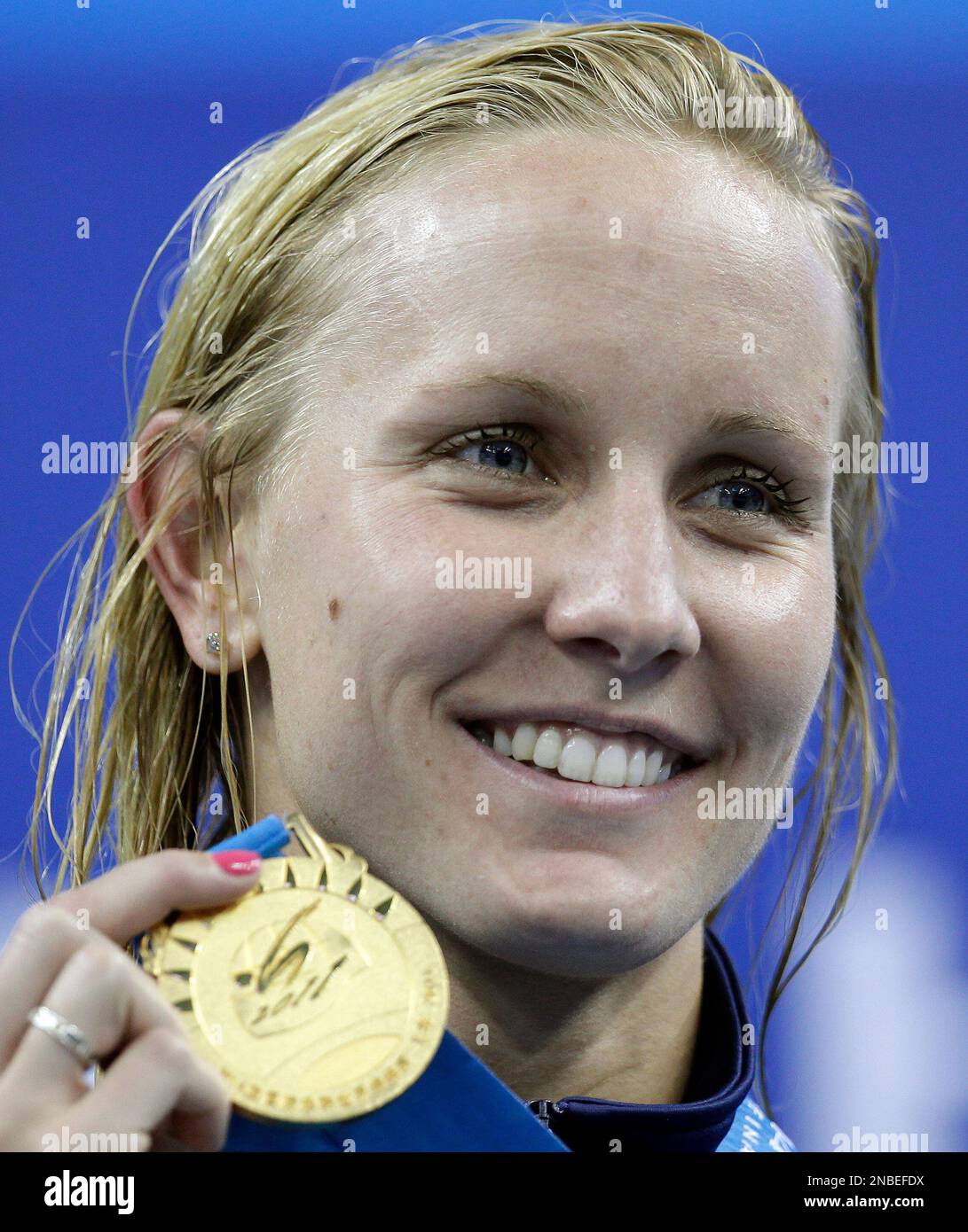 U.S. Jessica Hardy shows the gold medal she won in the women's 50m ...