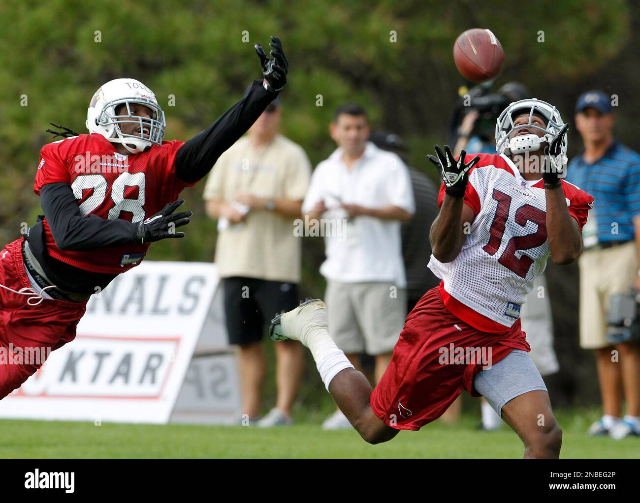 Arizona Cardinals' Andre Roberts (12) makes a catch over Greg Toler (28 ...