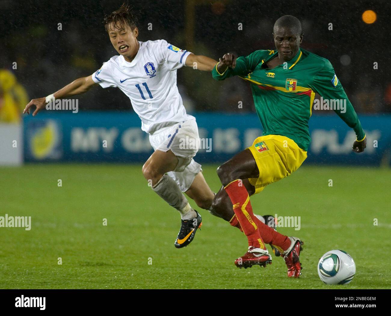 South Korea's Kim Kyung Jung, left, grabs Mali's Kalifa Traore during a ...
