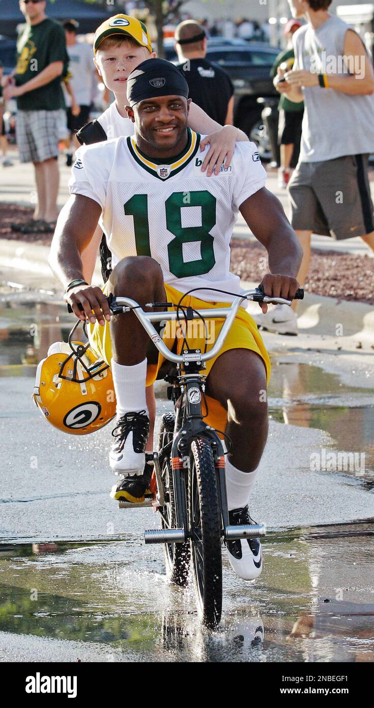 Green Bay Packers' Randall Cobb rides a bike to NFL football training ...