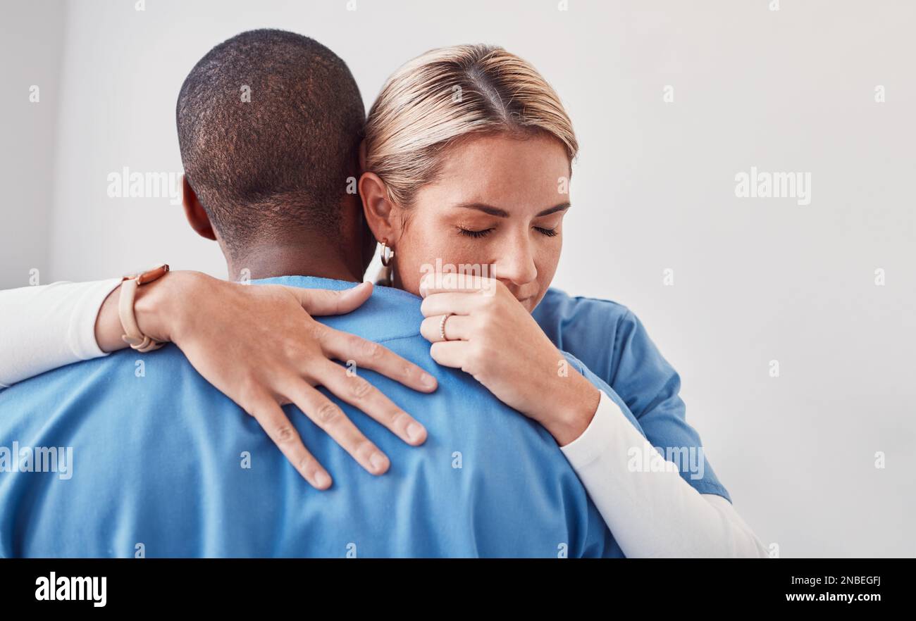 Comfort, support and doctors hugging in the hospital after the death of ...