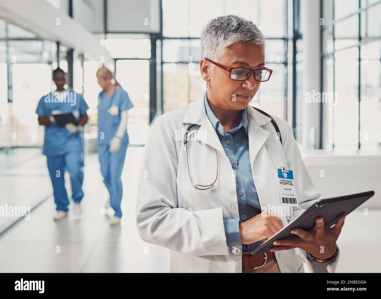 Doctor checking patient schedule hi-res stock photography and images ...