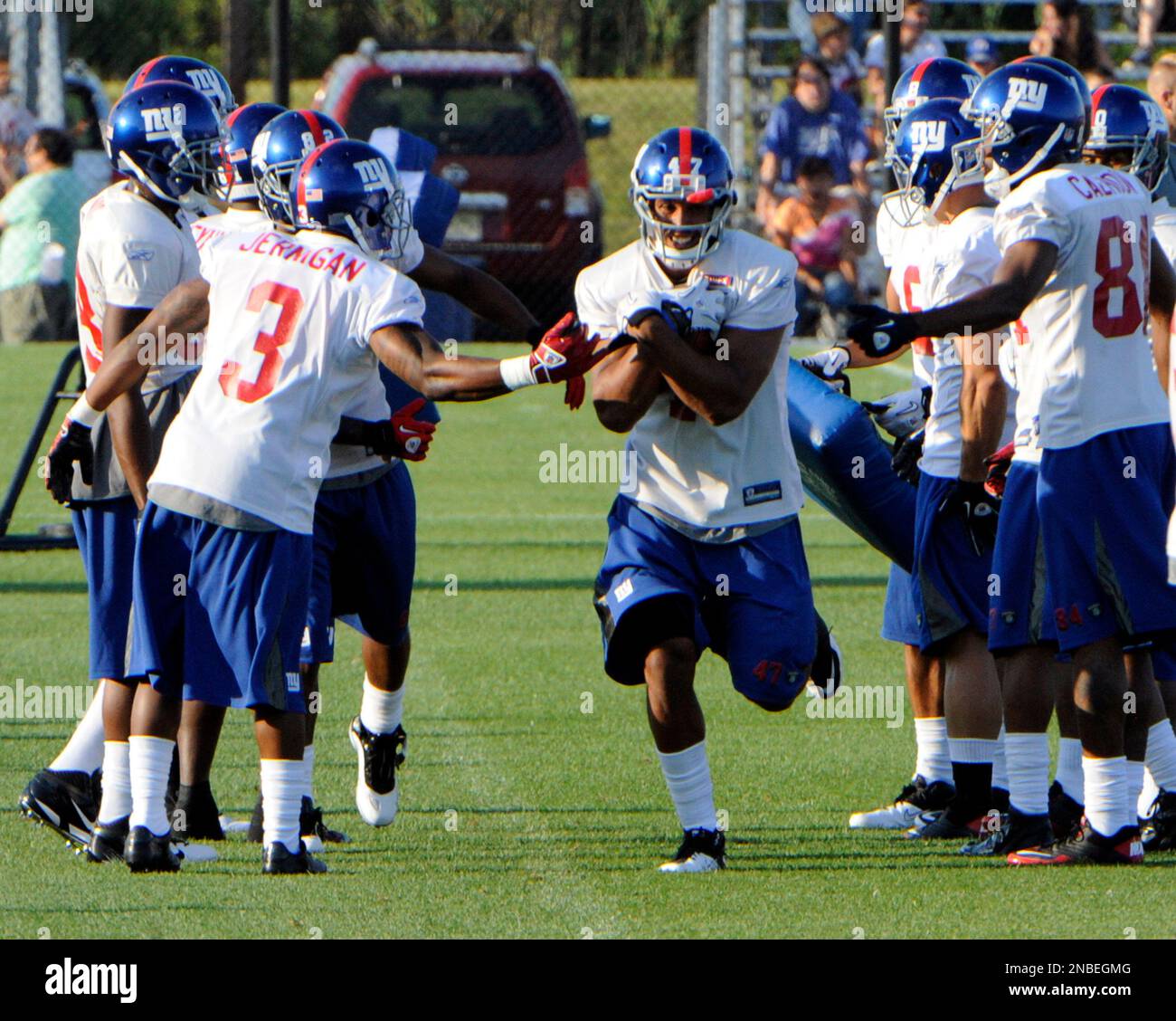 New York Giants tight end Travis Beckham (47) runs between teammates ...