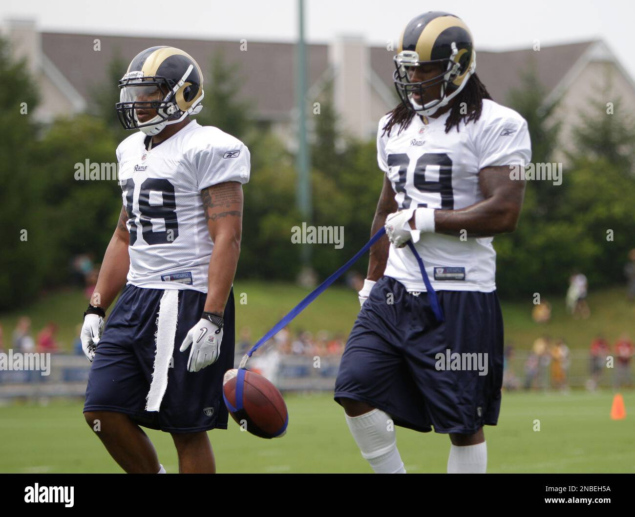 St. Louis Rams running back Steven Jackson, right, holds a ball on a ...