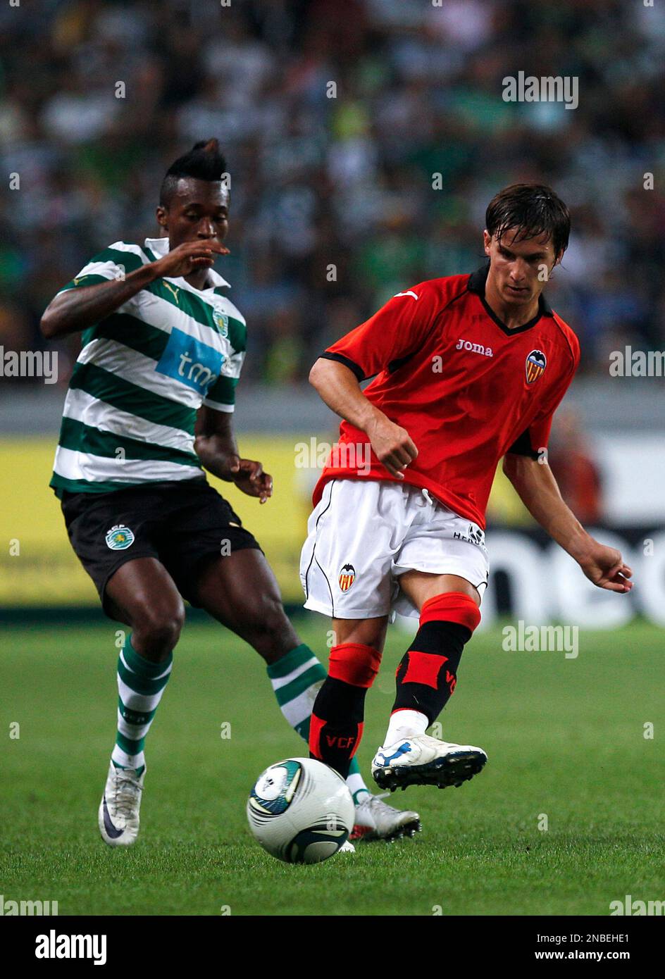 Valencia's Pablo Piatti, right, from Argentina, challenges Sporting's ...