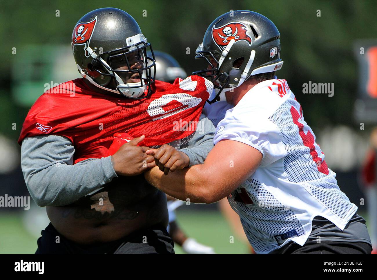 Tampa Bay Buccaneers defensive tackle Brian Price, left, works out with ...