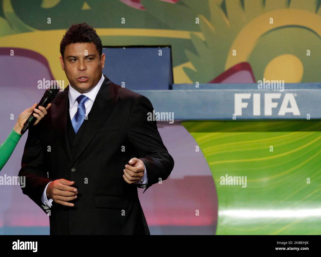 Former soccer player Ronaldo, of Brazil, speaks during the Preliminary ...