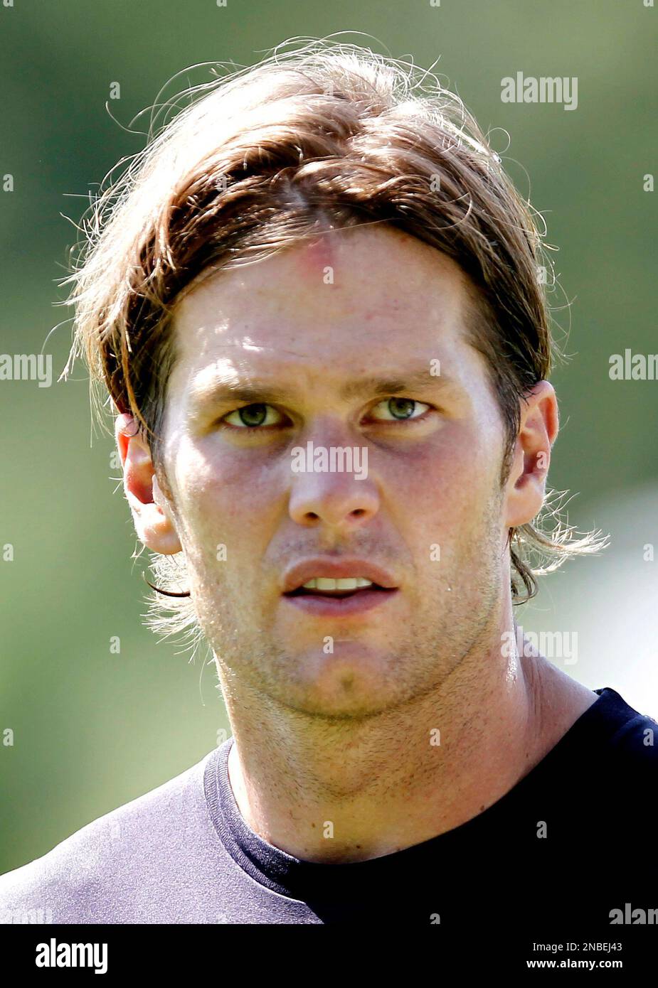 New England Patriots quarterback Tom Brady looks on during NFL football ...