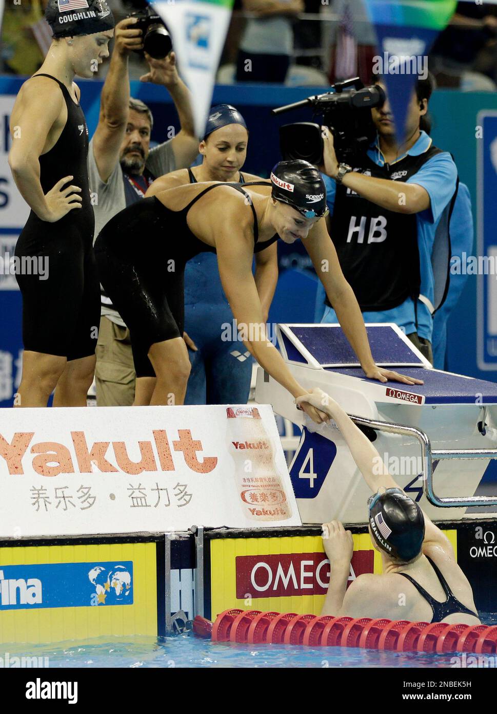 U.S. Melissa Franklin, bottom, is pulled out of the water by teammate ...