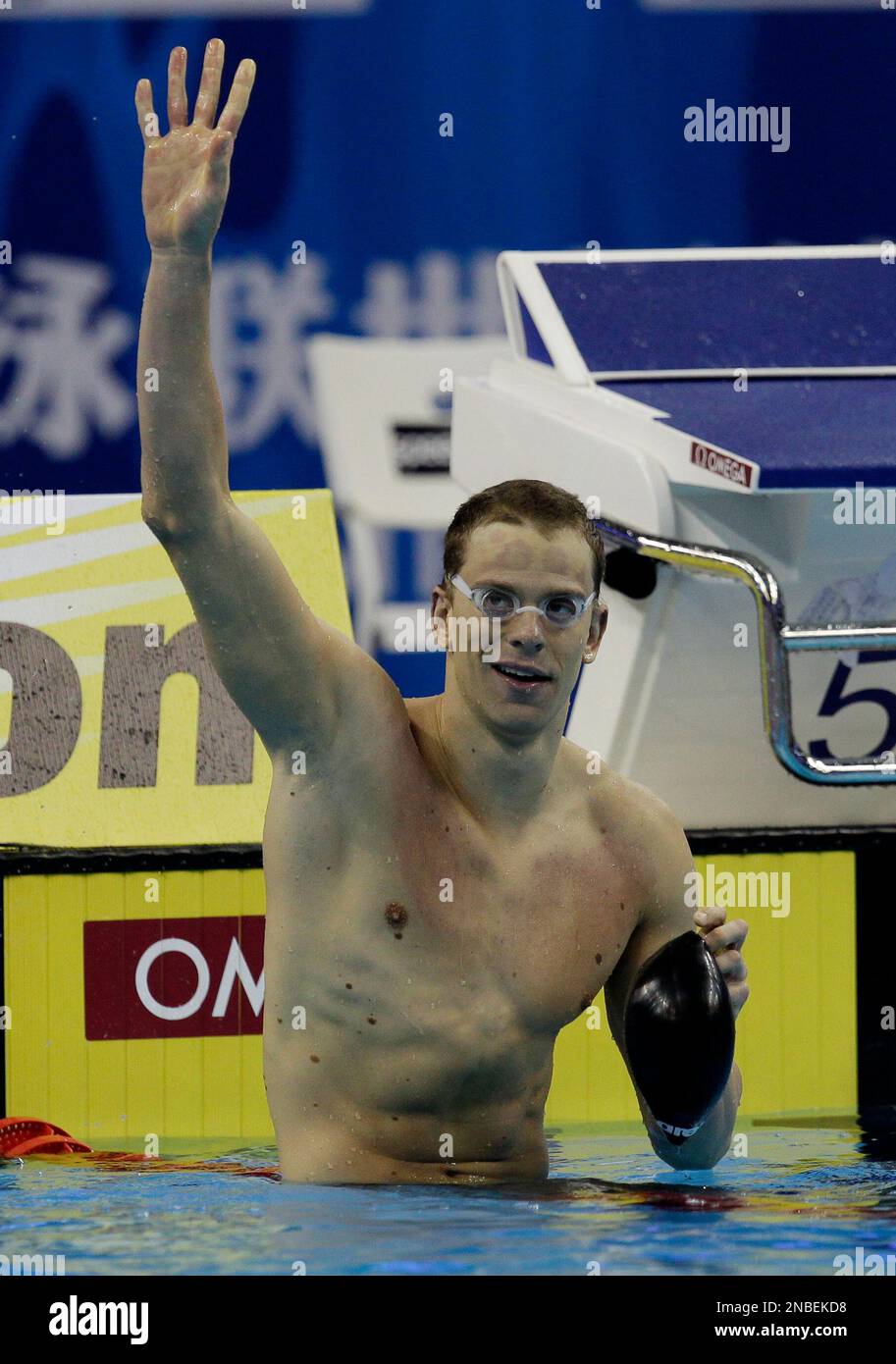 Brazil's Cesar Cielo waves from the pool after winning the gold medal ...
