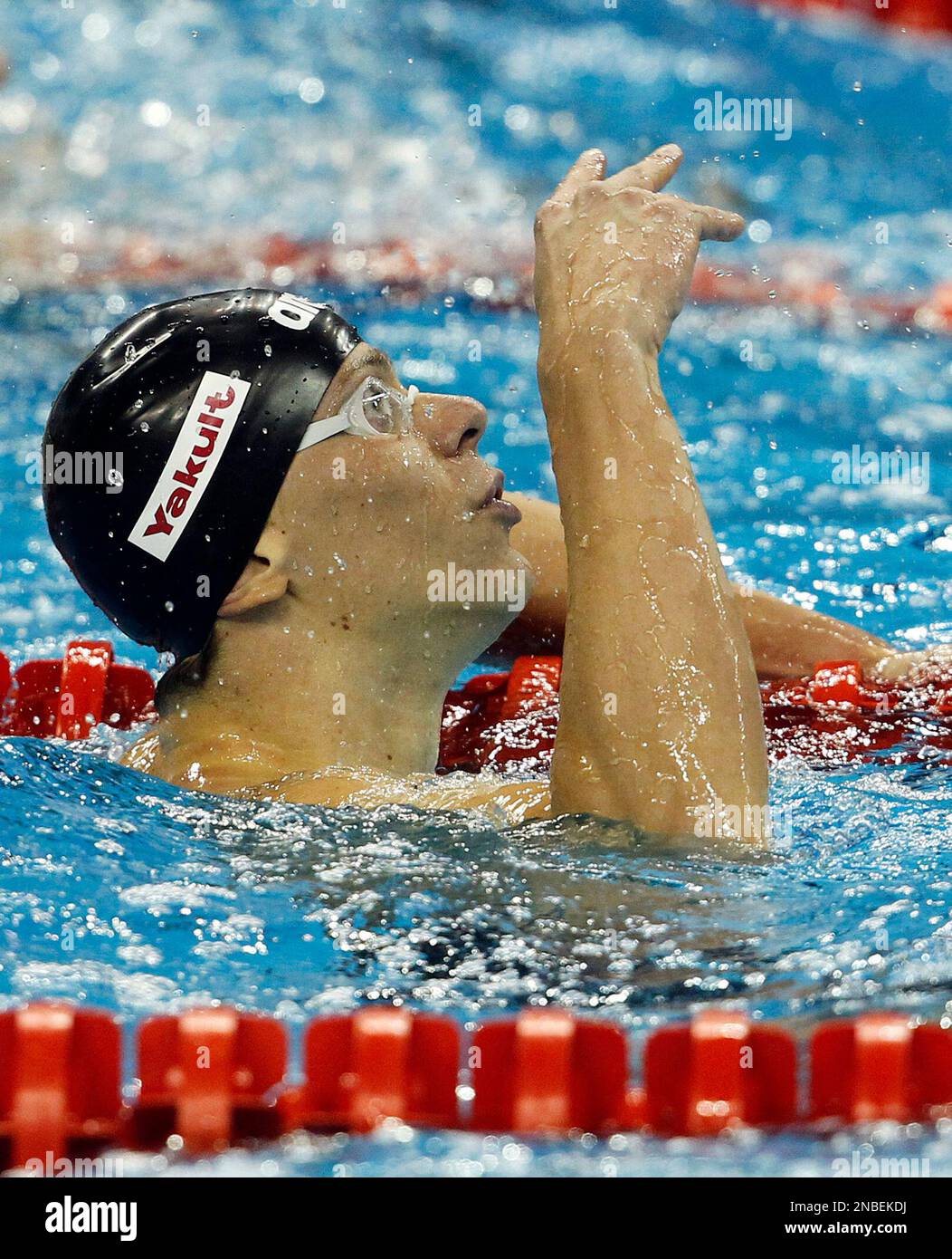 Brazil's Cesar Cielo looks up at the scoreboard after winning the gold ...