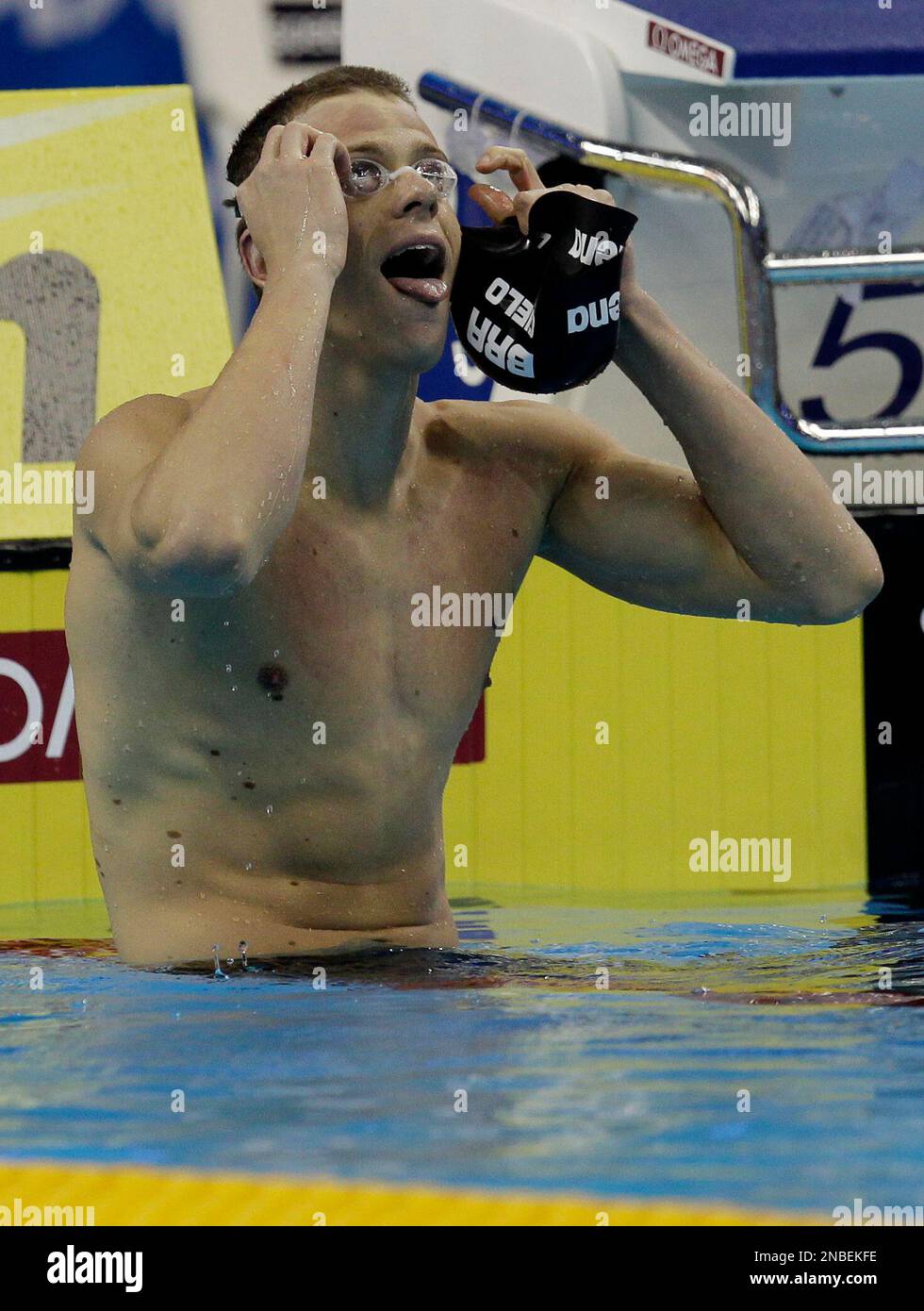 Brazil's Cesar Cielo prepares to take off his gogles after winning the ...