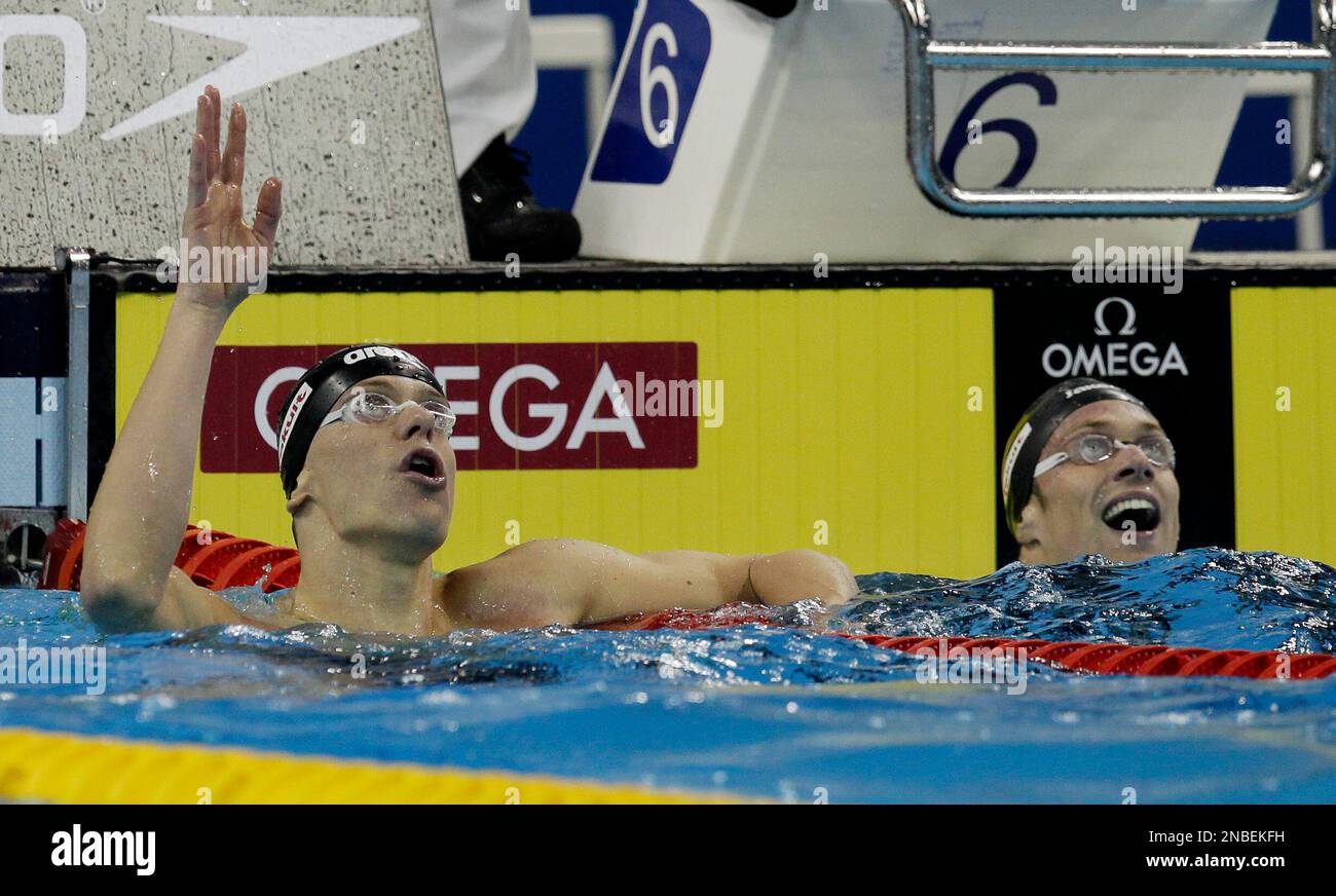 Brazil's Cesar Cielo, left, and Italy's Luca Dotto look up at the ...