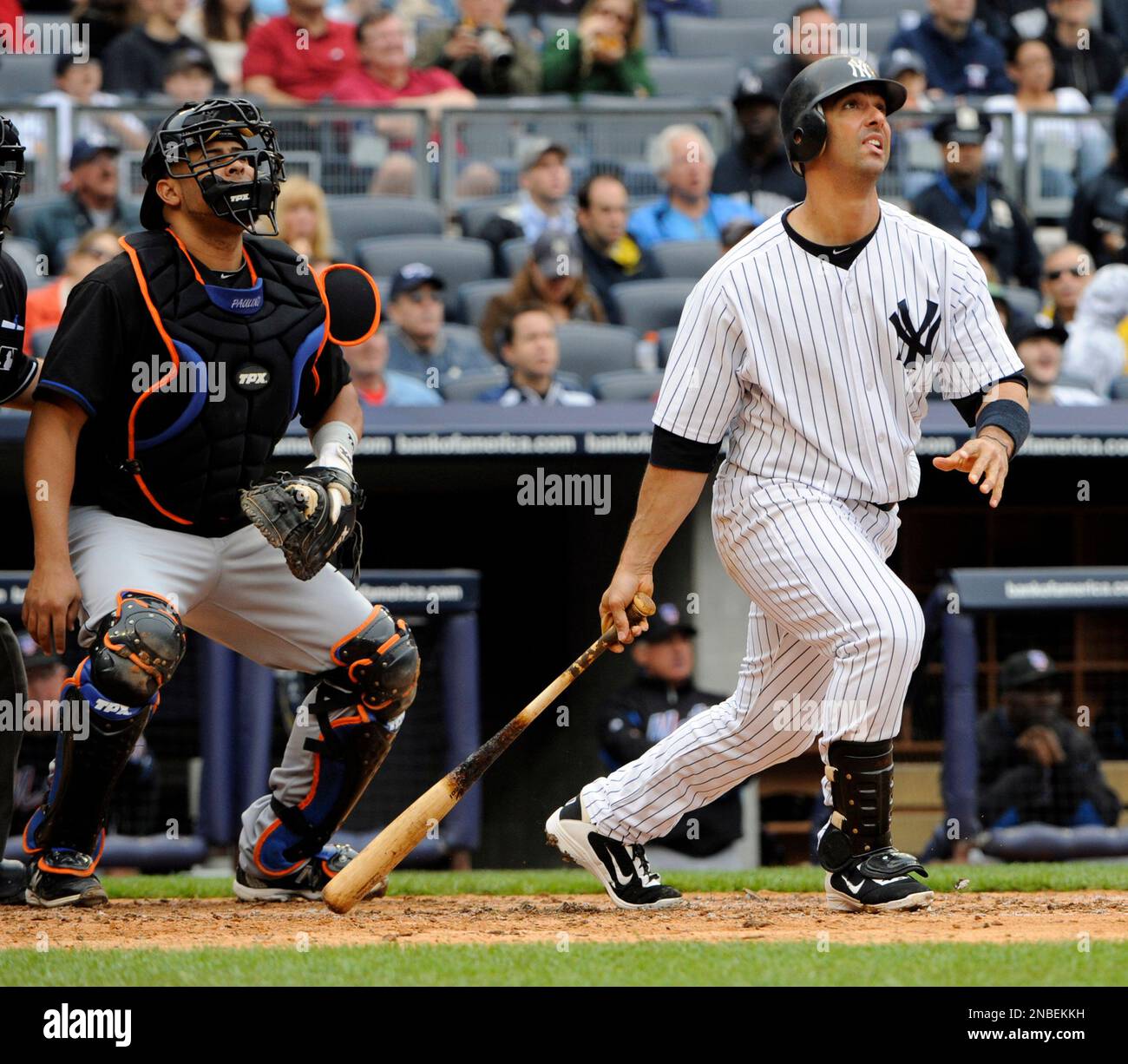 New York Yankees' Jorge Posada follows through on his drive as New York ...