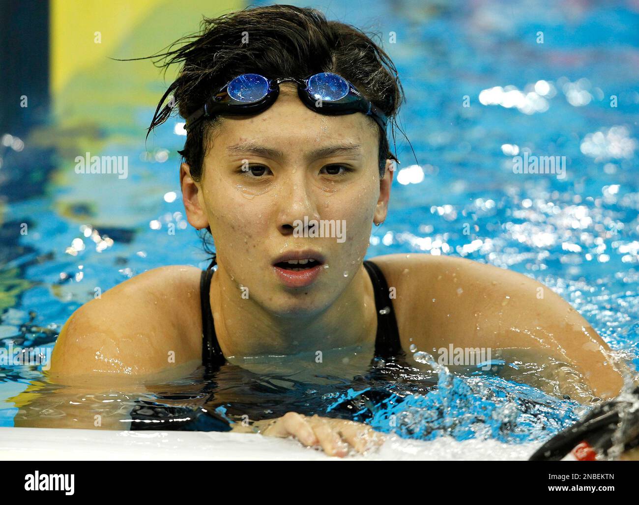 Singapore's Amanda Lim rests after her race in a women's 50m Freestyle ...