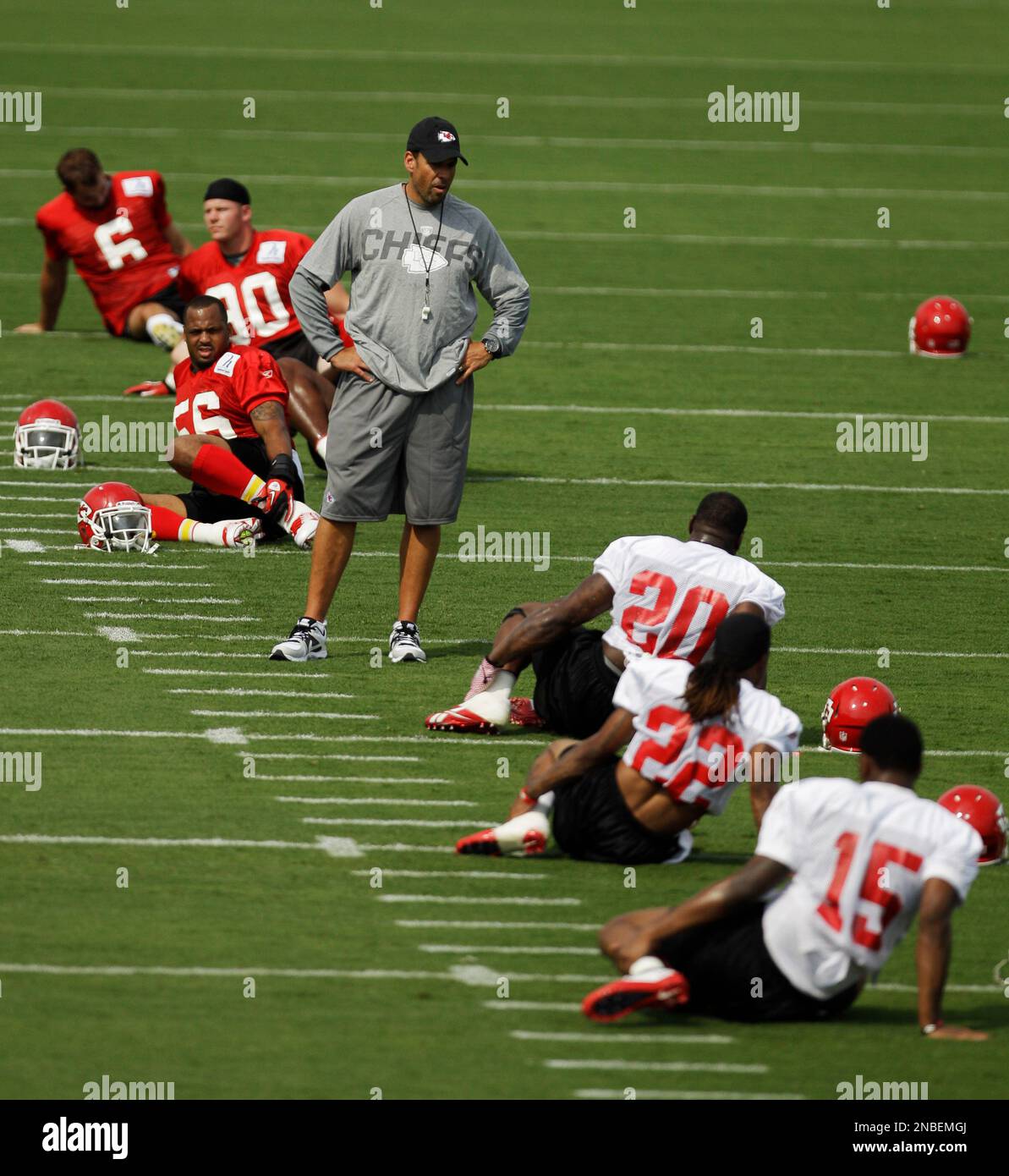 Kansas City Chiefs coach Todd Haley stands between the offense and ...
