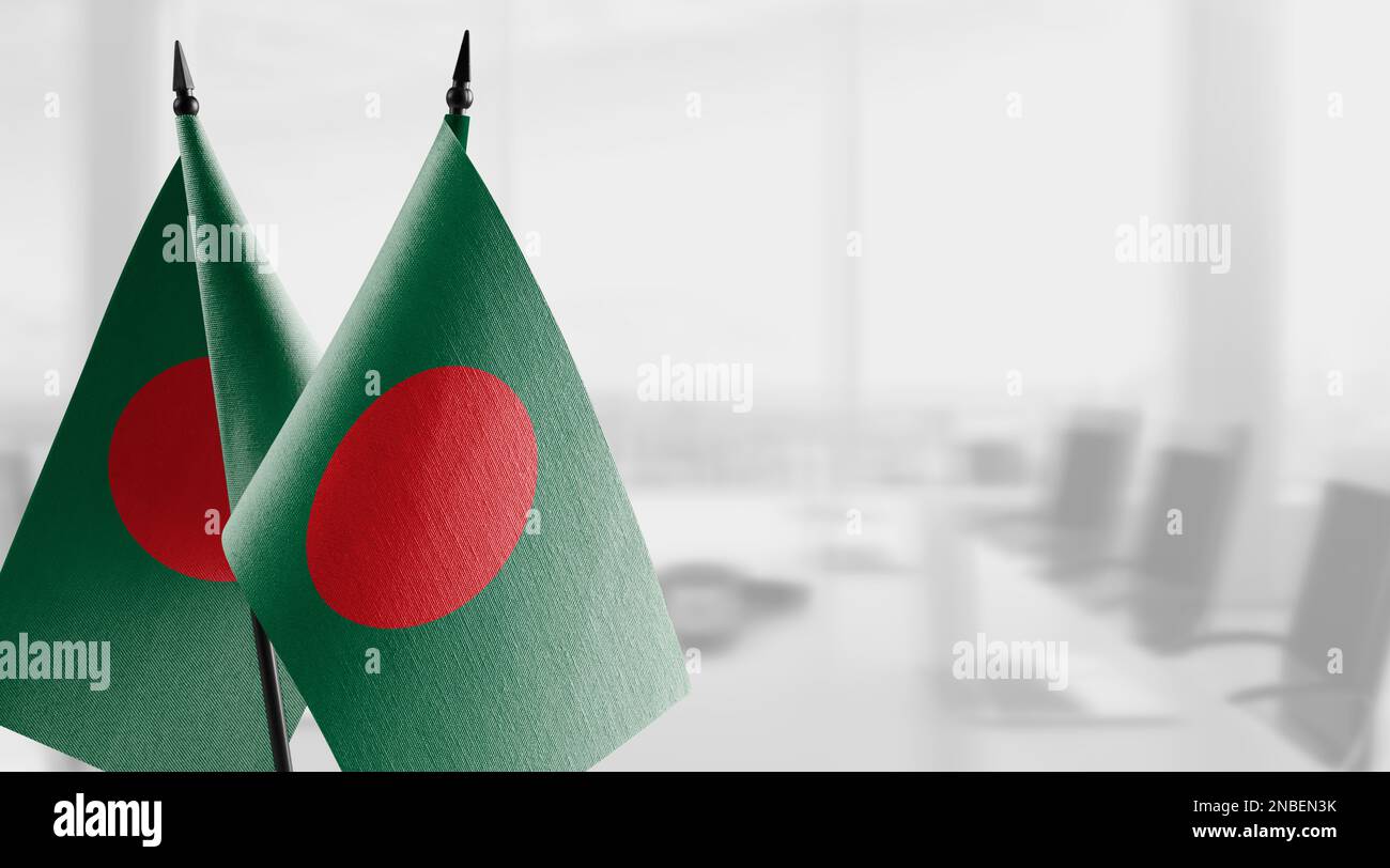 Small flags of the Bangladesh on an abstract blurry background Stock ...