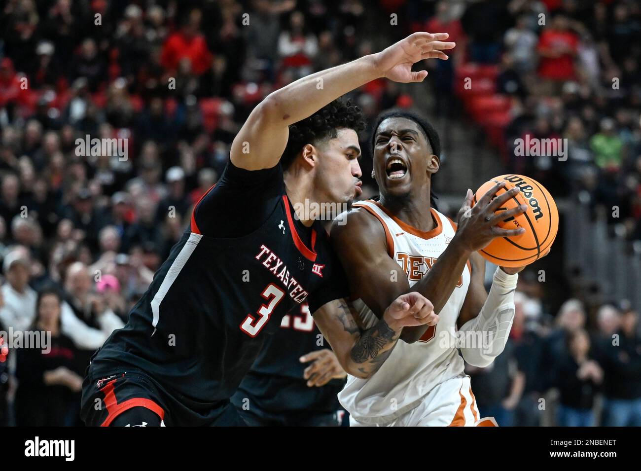 Texas guard Marcus Carr drives to the basket against Texas Tech guard D ...