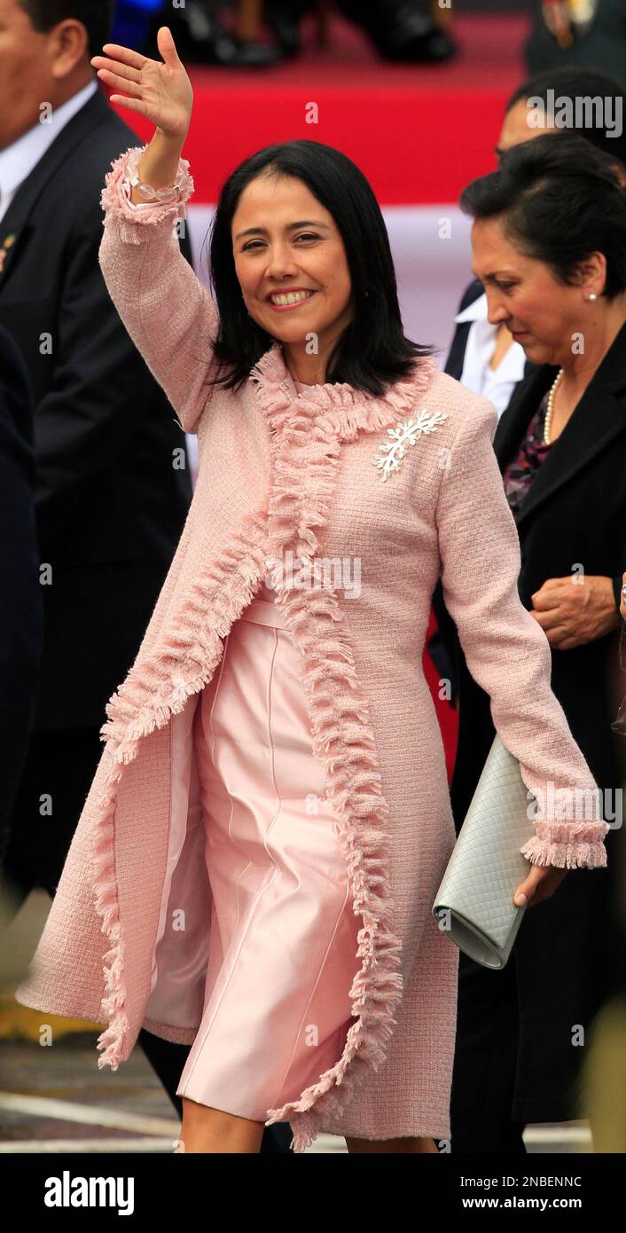Peru's first lady Nadine Heredia waves to reporters as she arrives to ...