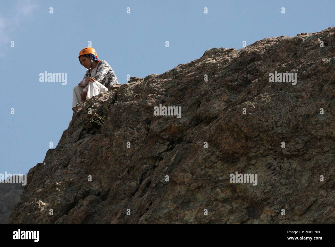Female Iranian climber, Targol Anvarinejad, sits over the Maryam rock ...