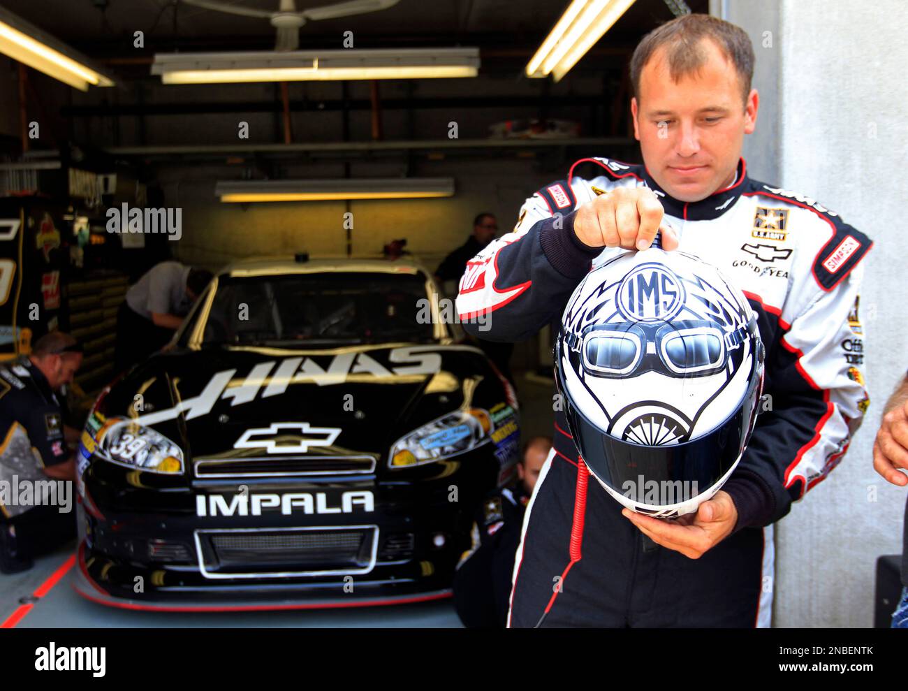 Ryan Newman looks over the paint scheme on his helmet before the start ...
