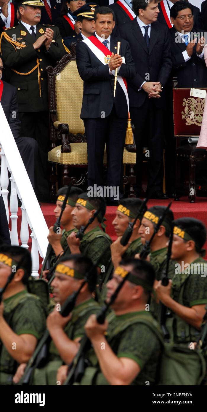 Peru's President Ollanta Humala, top center, applauds during a military ...