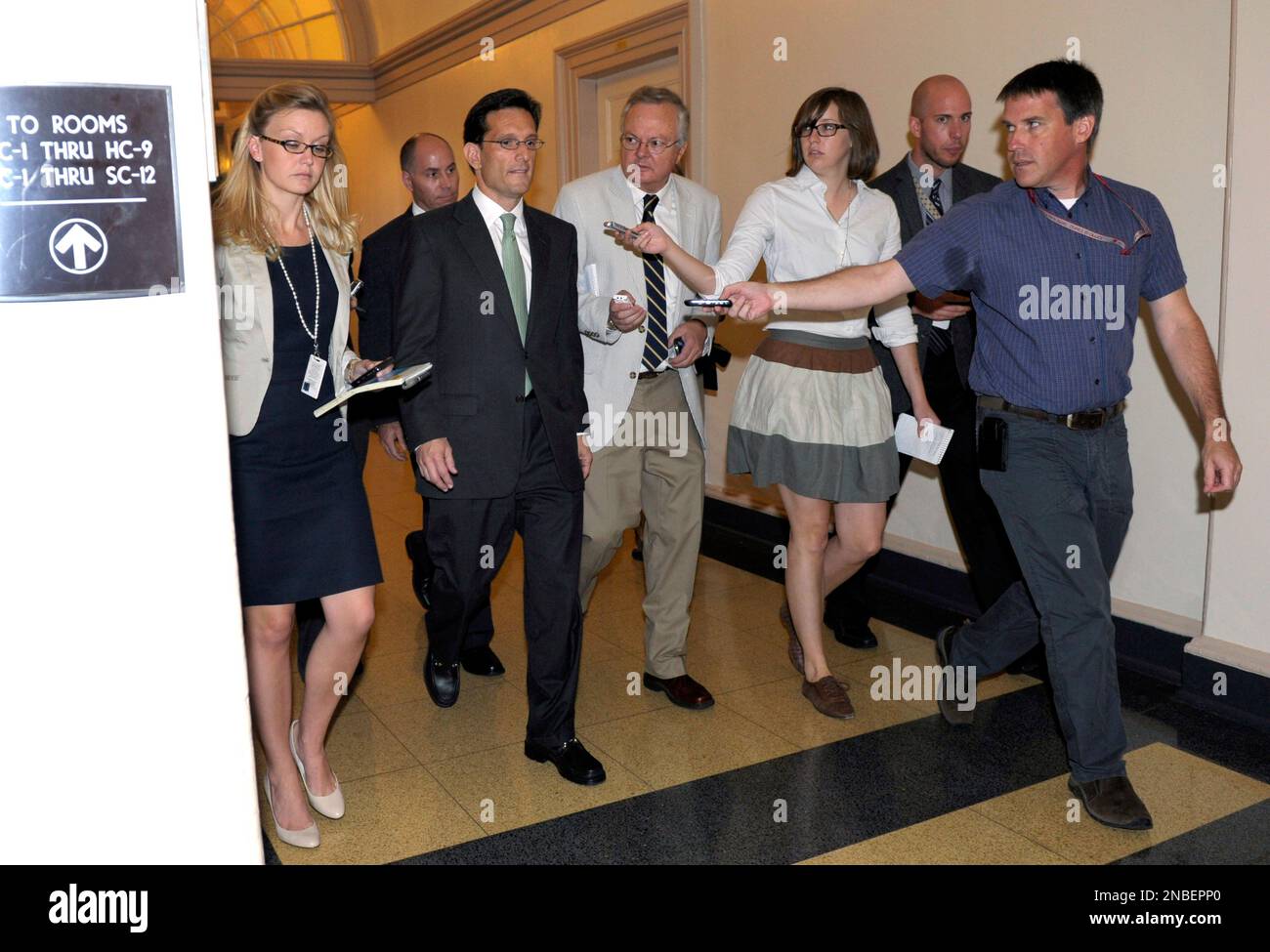 House Majority Leader Eric Cantor of Va., is followed by reporters as ...