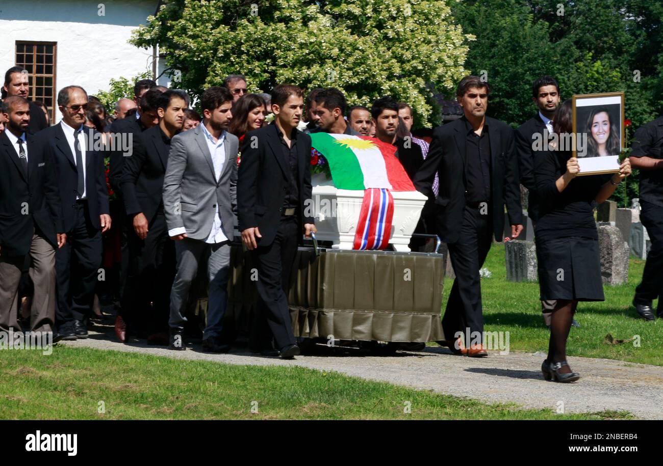 Mourners push the coffin of Bano Abobakar Rashid, 18, the first victim ...